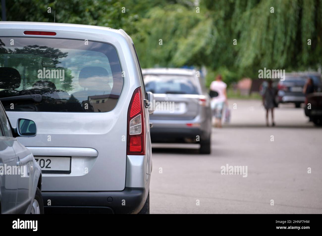 Cars parked in line on city street side. Urban traffic concept Stock ...
