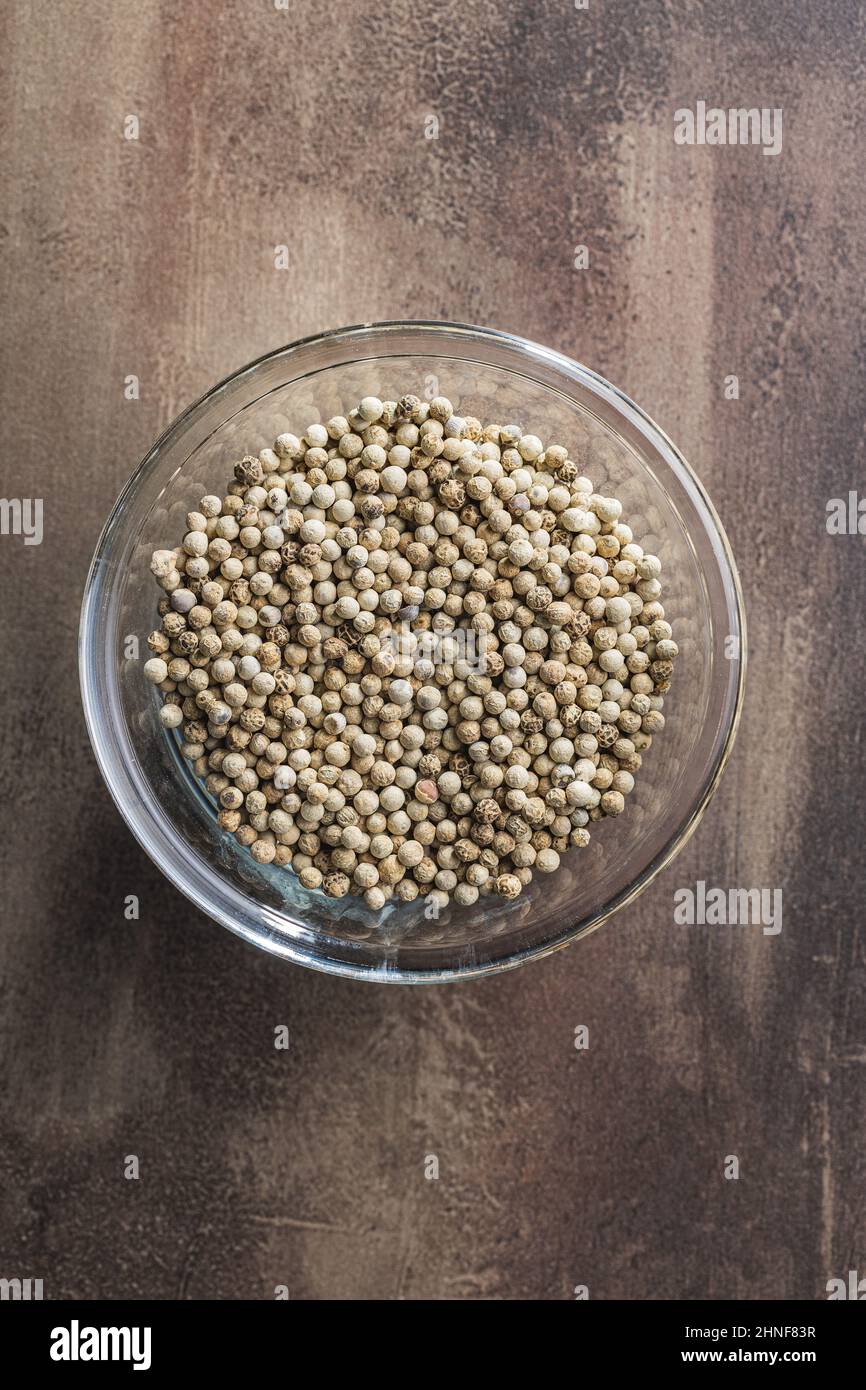 Whole pepper spice. White peppercorn in a bowl. Top view Stock Photo ...