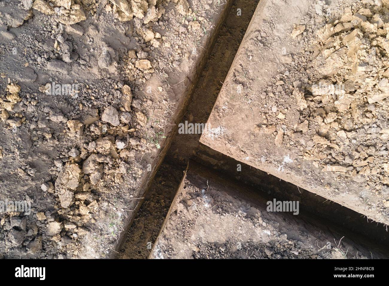 Dug out trench for building works of new house concrete foundation on ...