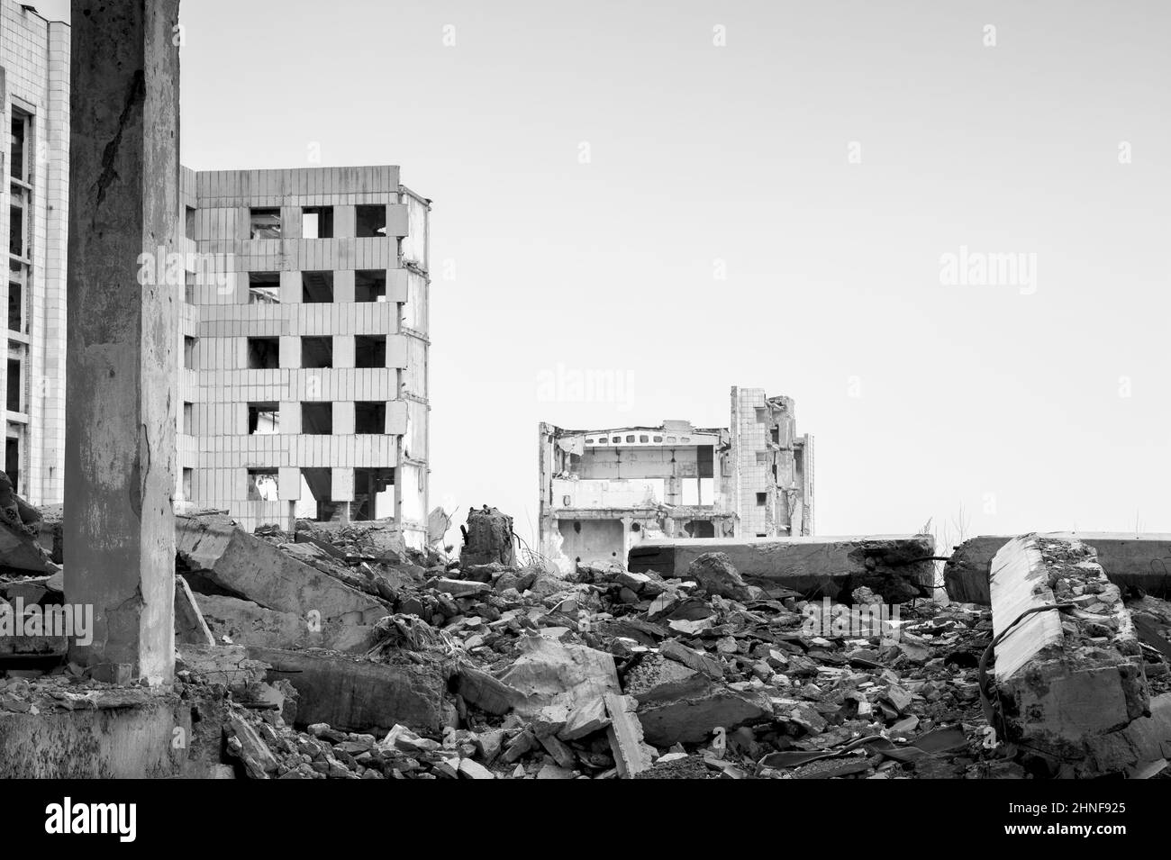 The destroyed large concrete building with a bunch of huge fragments of ...