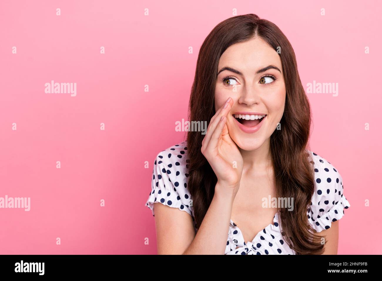 Photo of funny funky lady dressed dotted dress arm lips telling secret ...