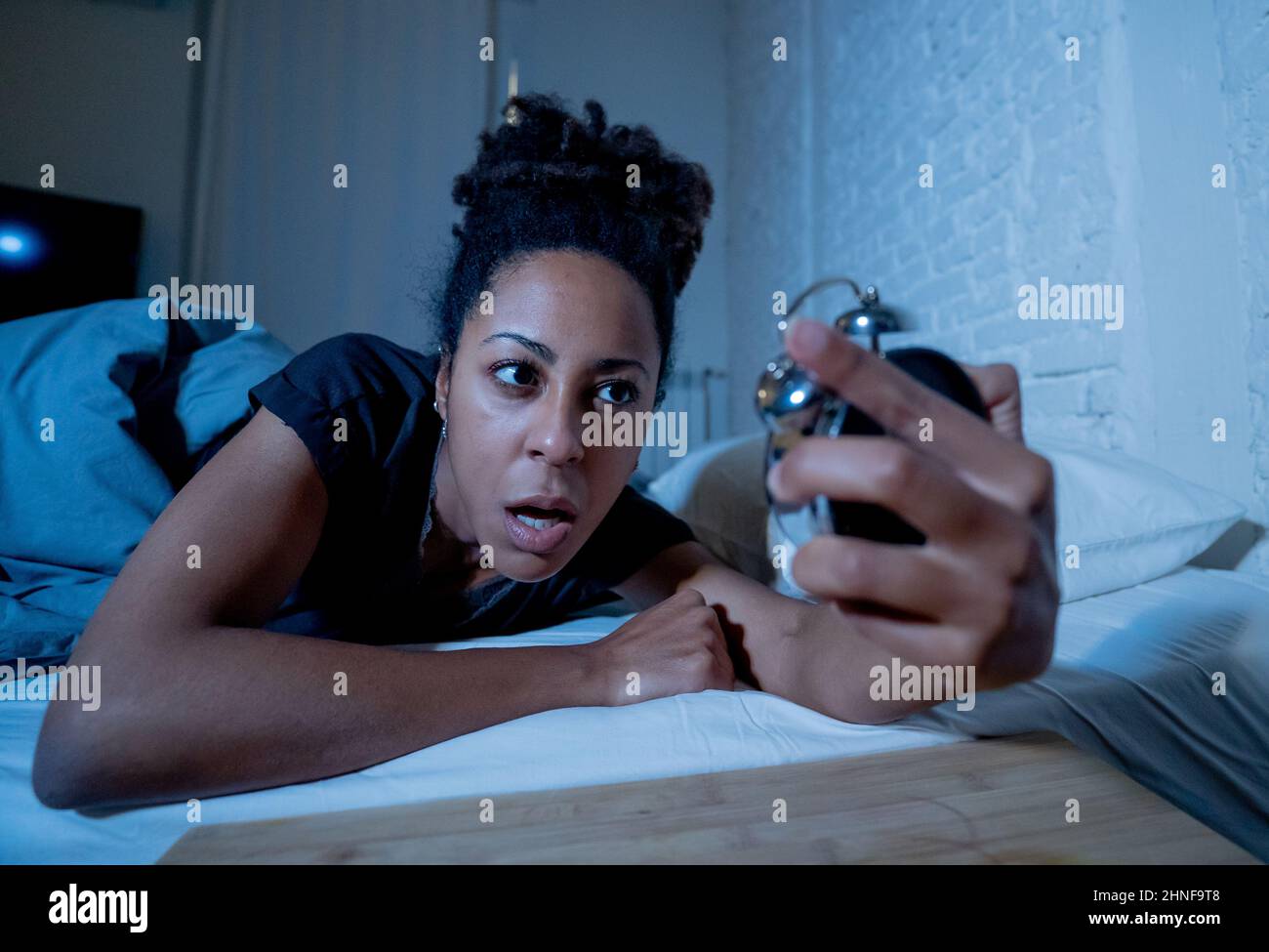 Sleepless and desperate beautiful afro american woman awake at night ...