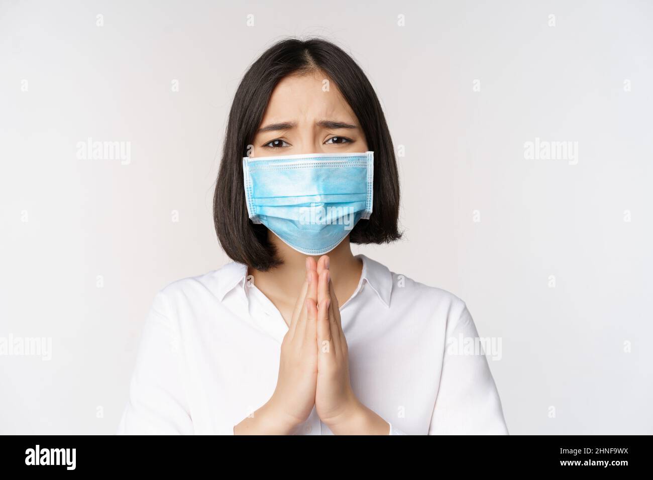 Portrait of asian woman in medical face mask from covid, begging ...