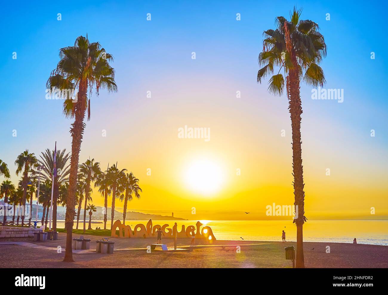 MALAGA, SPAIN - SEPTEMBER 29, 2019: The scenic palm trees and bright ...