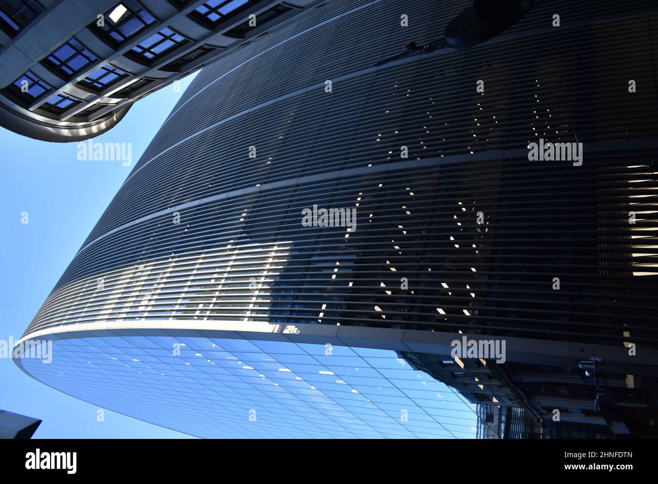 Beautiful view of a modern skyscraper in a city under the blue sky ...