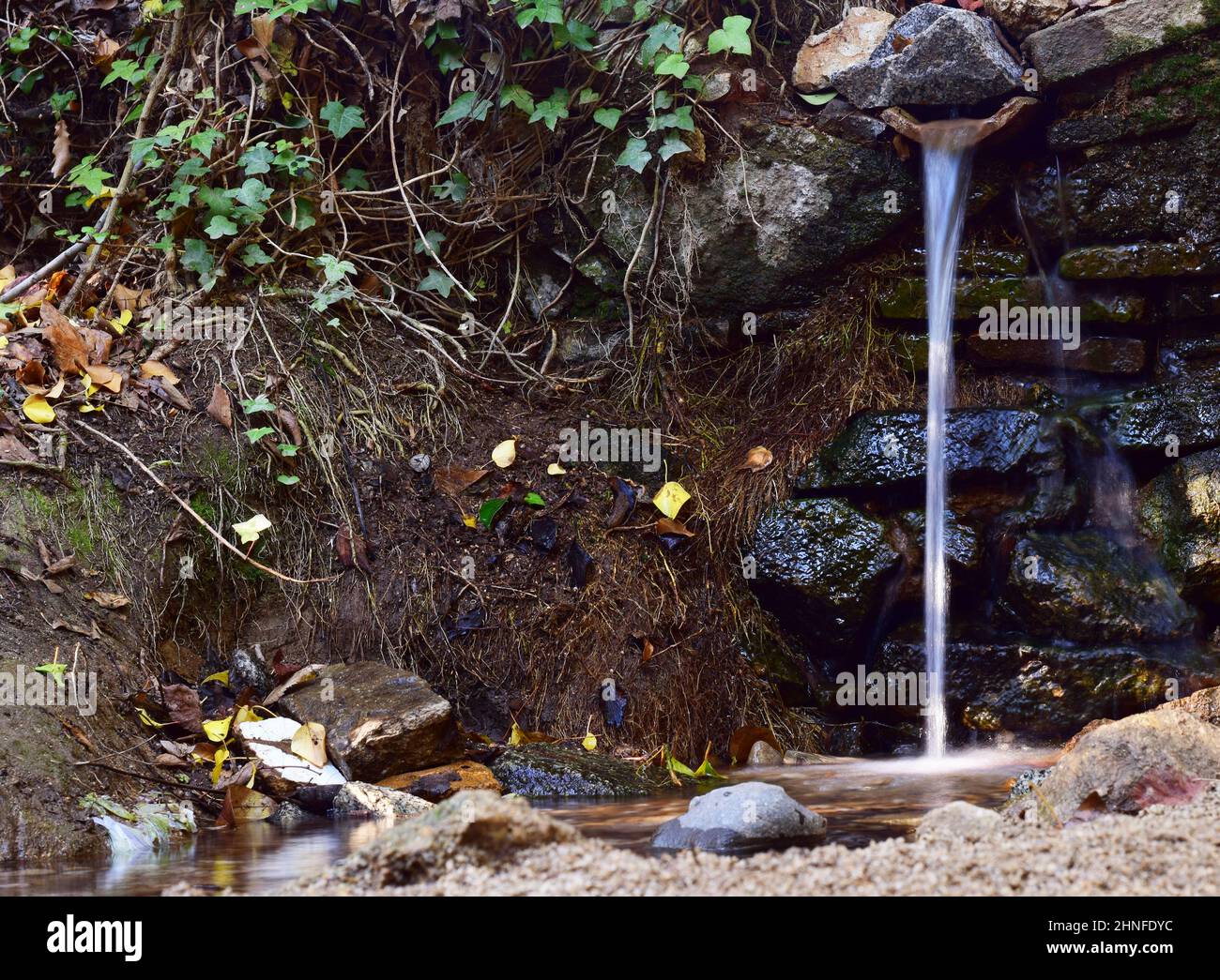 View of water dripping from the stones Stock Photo - Alamy