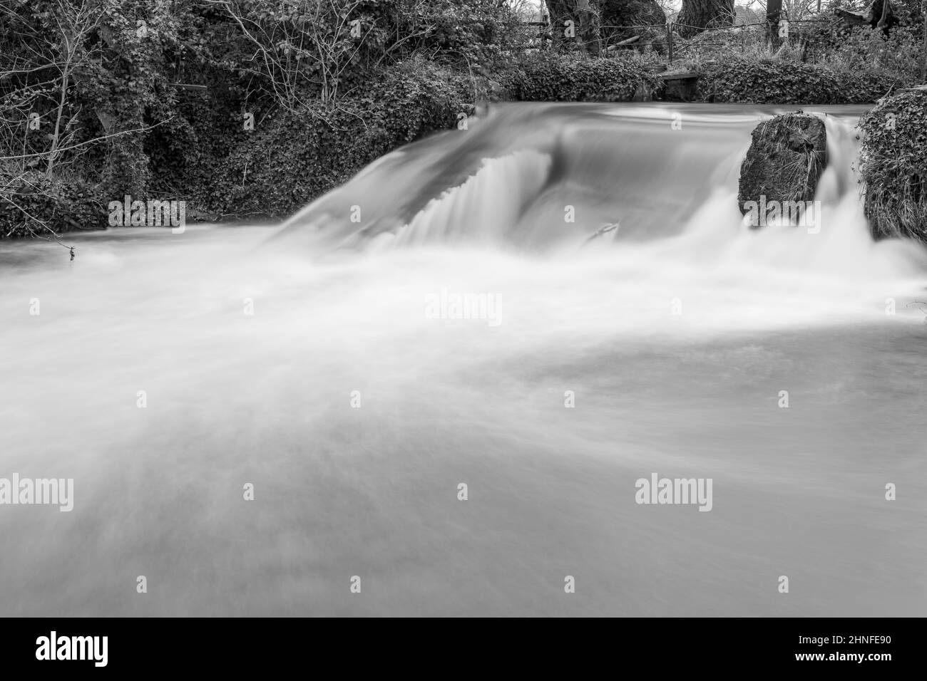 Long exposure of a waterfall on the river Avill in Dunster in Somerset ...