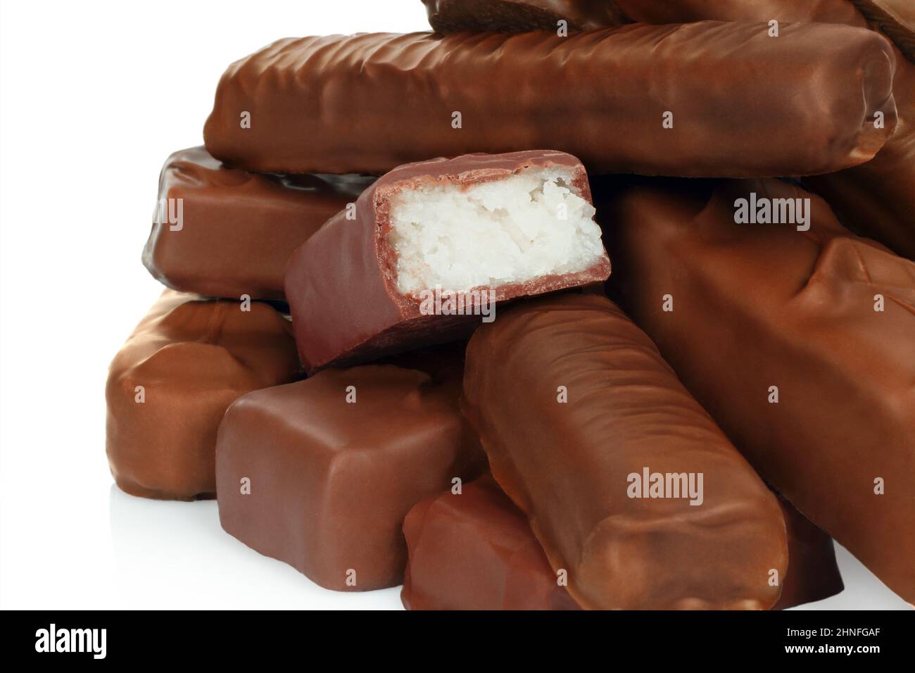 Heap of chocolate bars on white background close-up Stock Photo - Alamy