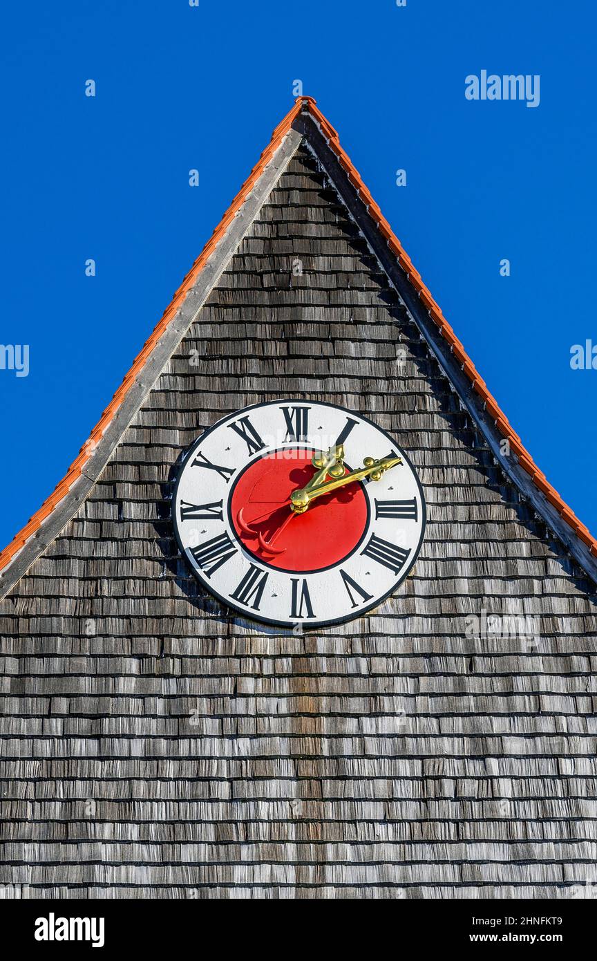 Church tower with clock and wooden shingles, Church of St. Stephan in ...