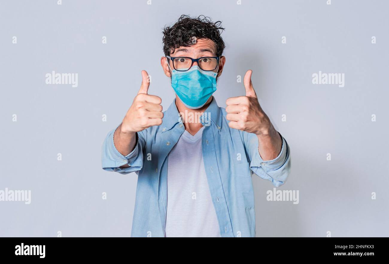 Man with mask on and thumbs up, Latino guy giving thumbs up with mask ...