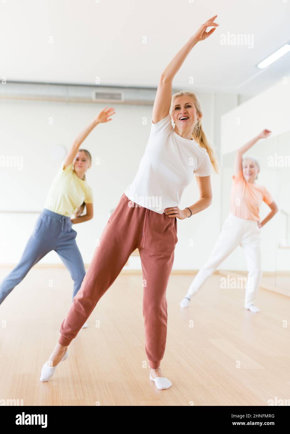 Modern active females dancing excited posing in studio Stock Photo - Alamy