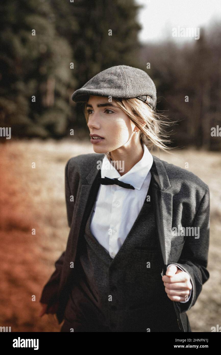 Young woman in dandy style in the meadow Stock Photo - Alamy