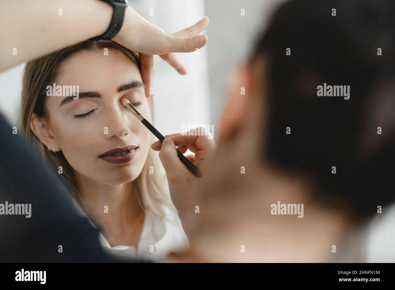 Young woman gets made up Stock Photo - Alamy
