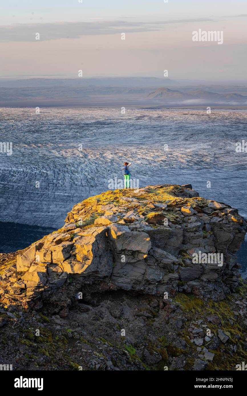 Hiker looks over spectacular landscape, Myrdalsjoekull glacier, Pakgil ...