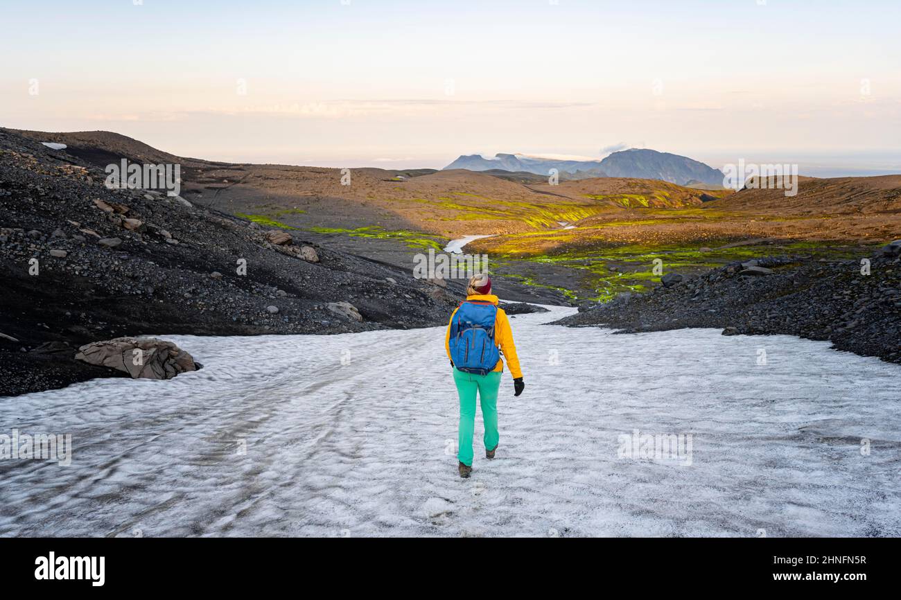 Hiker walks through spectacular landscape, Pakgil, Iceland Stock Photo ...