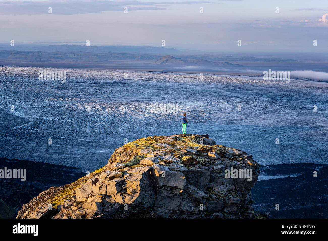 Hiker looks over spectacular landscape, Myrdalsjoekull glacier, Pakgil ...