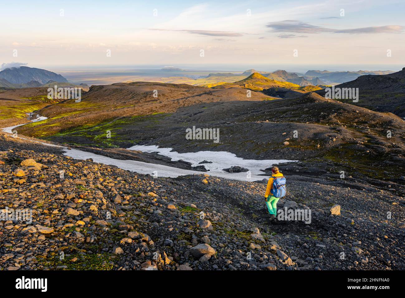 Hiker walks through spectacular landscape, Pakgil, Iceland Stock Photo ...