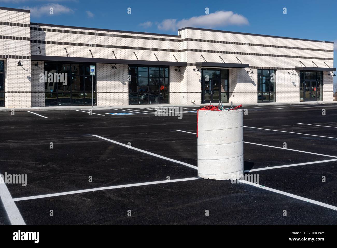 Horizontal shot of an almost complete commercial strip shopping center ...