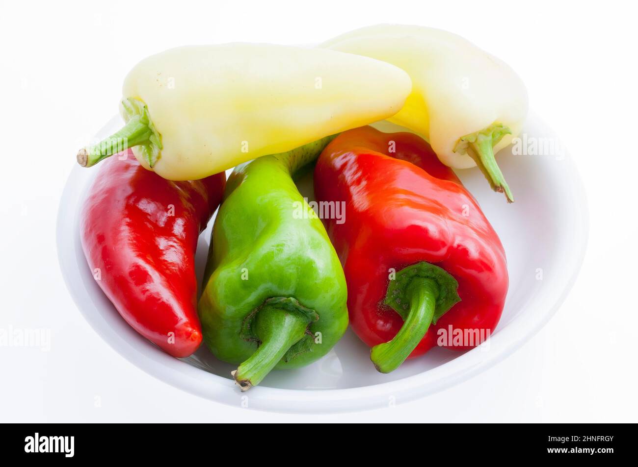 Red, yellow and green pointed peppers (Capsicum annuum), vegetables ...