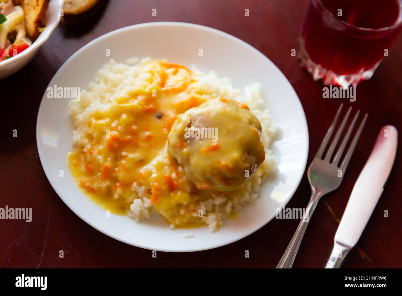 Meatball tefteli with rice and sauce Stock Photo - Alamy