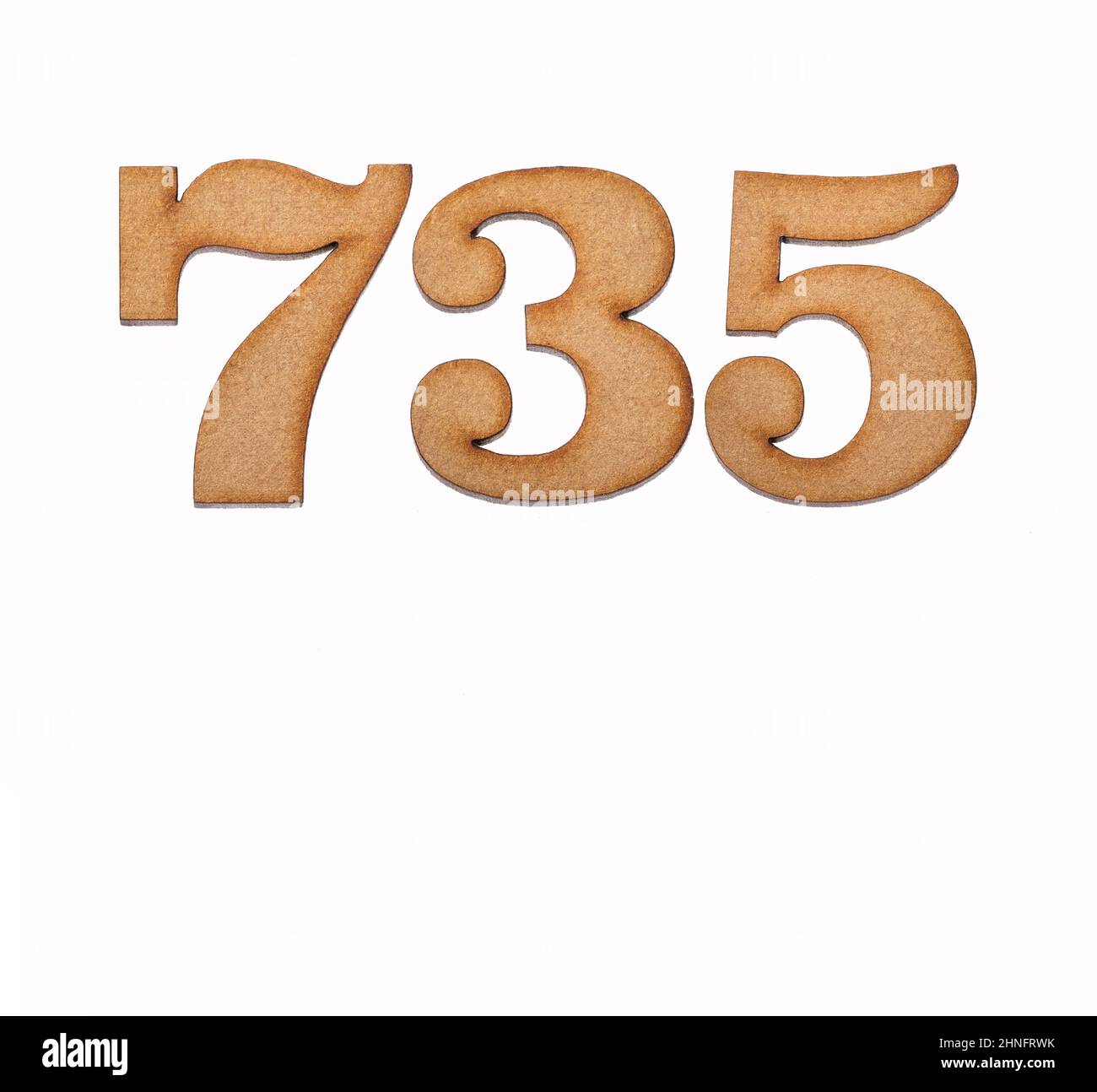 Number 735 in wood, isolated on white background Stock Photo - Alamy