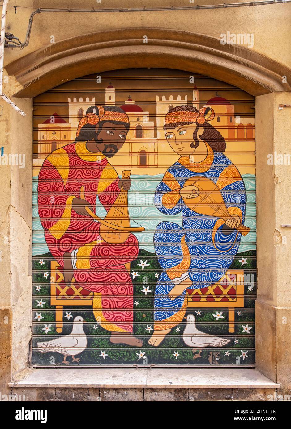 Colorful painted roller shutters on shop display window, Kasbah Mazara ...