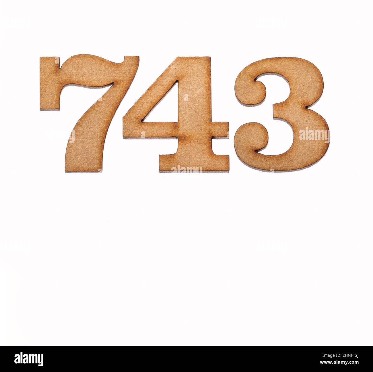 Number 743 in wood, isolated on white background Stock Photo - Alamy