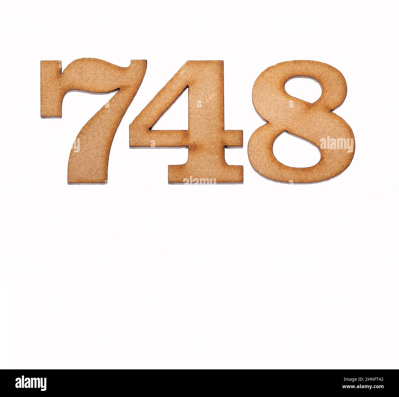 Number 748 - Piece of wood isolated on white background Stock Photo - Alamy