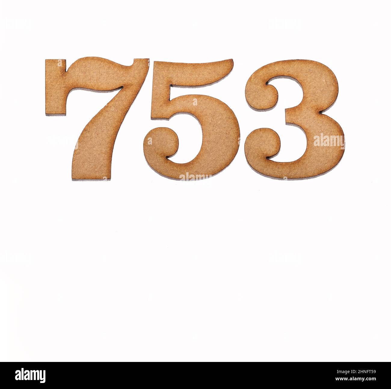 Number 753 in wood, isolated on white background Stock Photo - Alamy