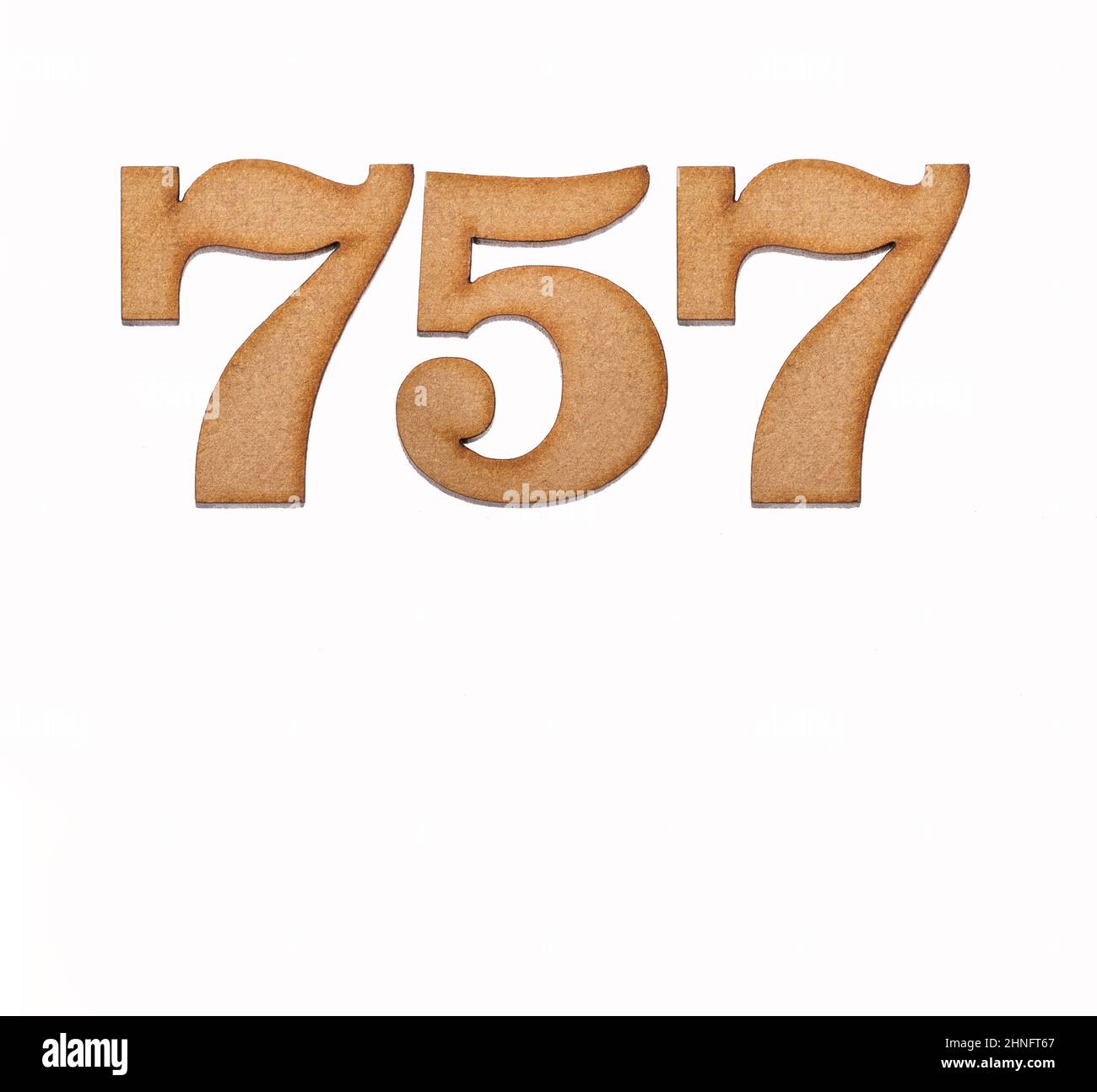 Number 757 in wood, isolated on white background Stock Photo - Alamy