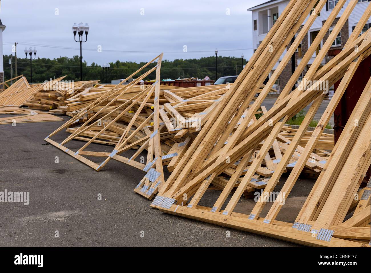 Stacked wooden timber for trusses for roof near construction site Stock ...