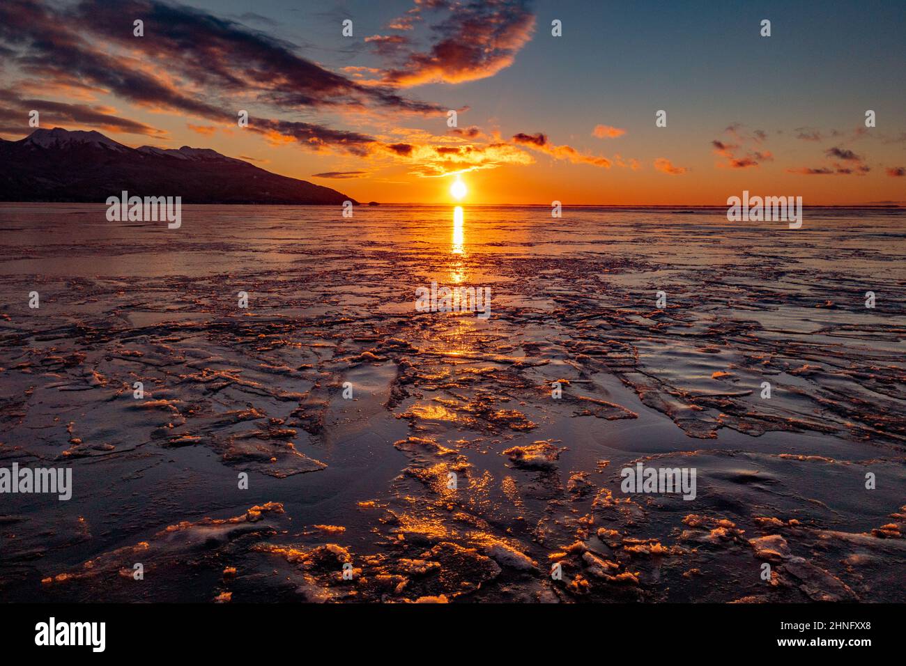 Sunset glows across Cook Inlet and the headwaters of Turnagain Arm near ...