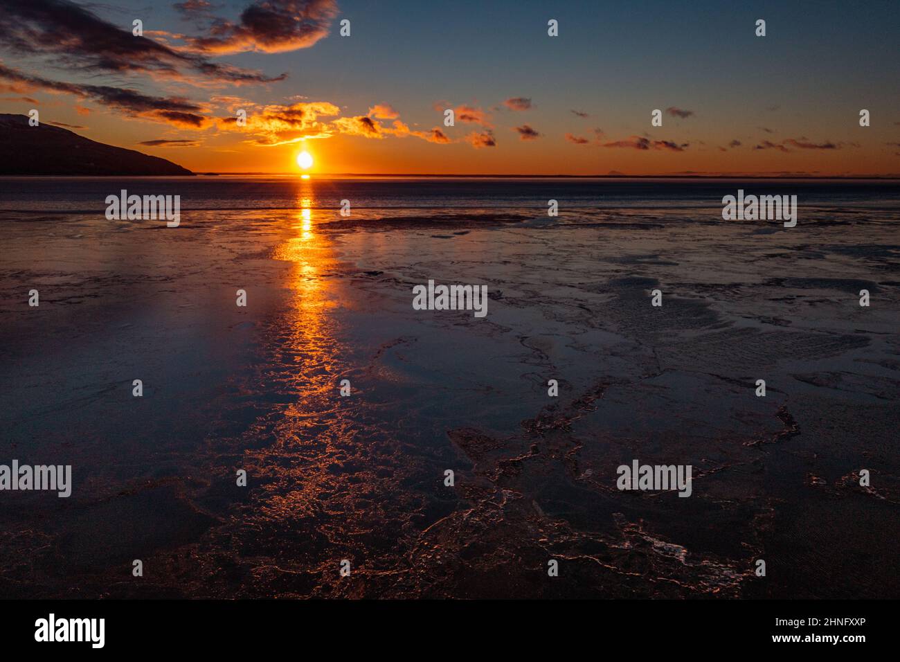 Sunset glows across Cook Inlet and the headwaters of Turnagain Arm near ...