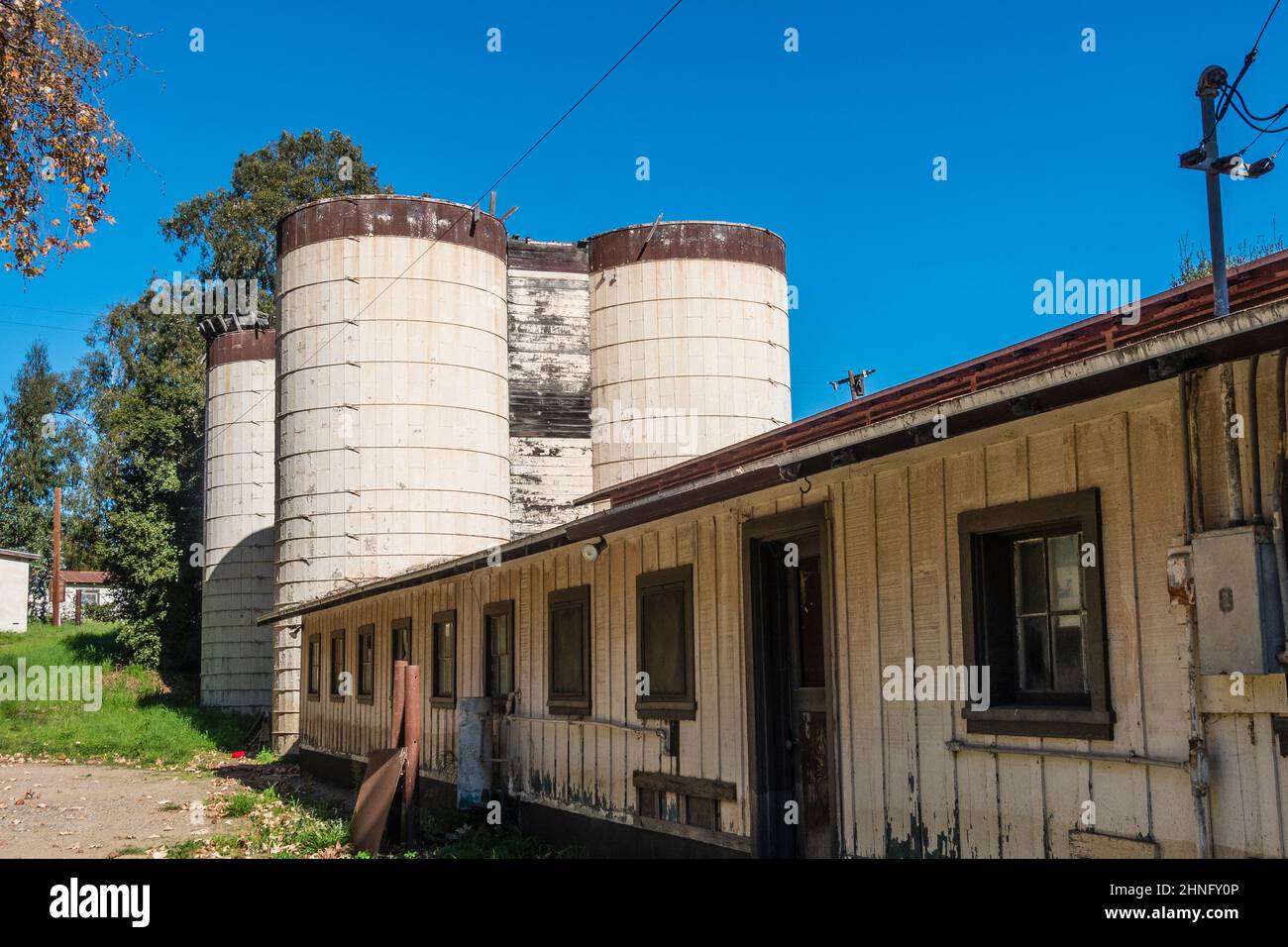 A group of abandoned silos and a farm building on the historic Dos ...