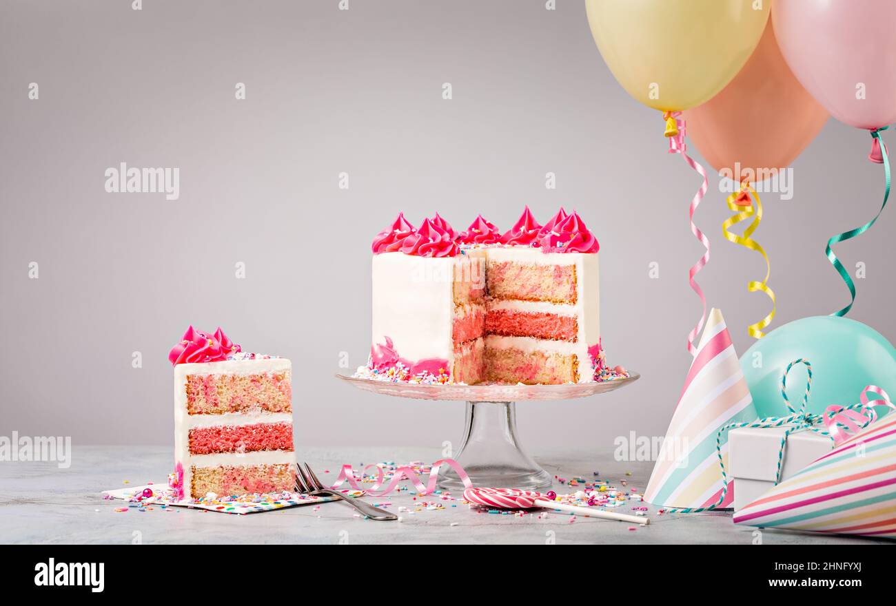 Birthday Party with Sliced Pink funfetti Cake Stock Photo - Alamy