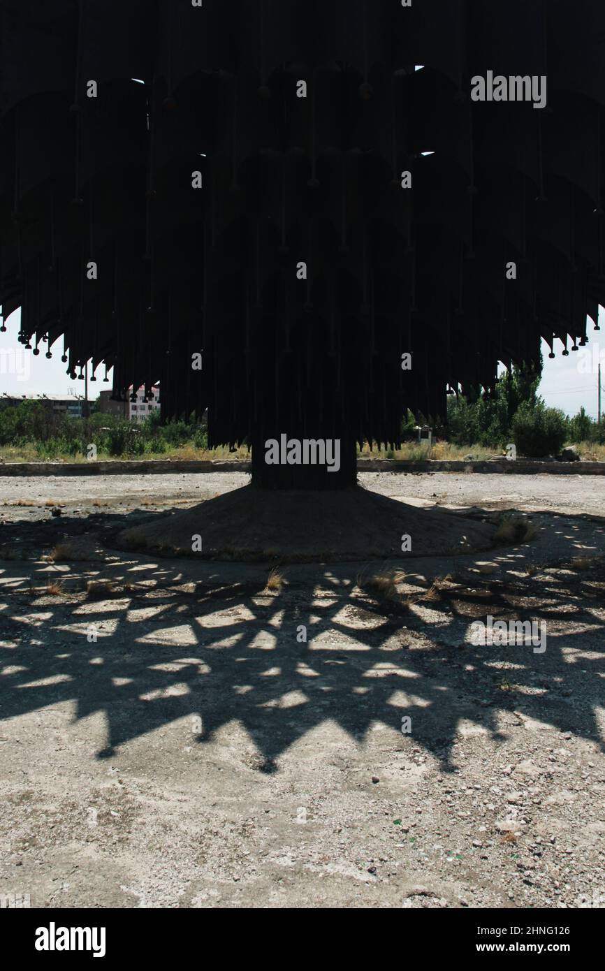 Beautiful fountain with a shadow on the ground Stock Photo - Alamy