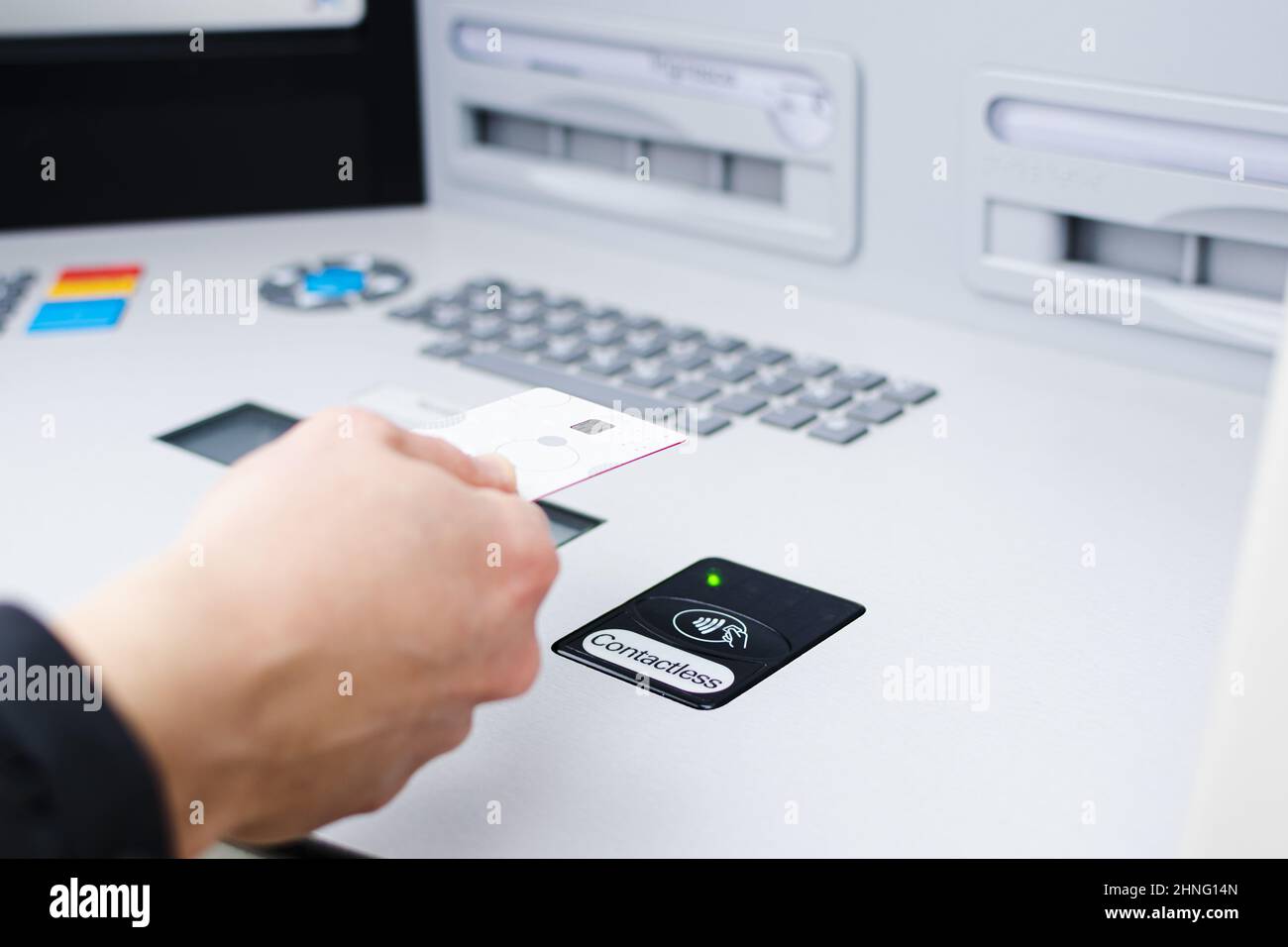 Male using a credit card at a Contactless ATM Stock Photo - Alamy