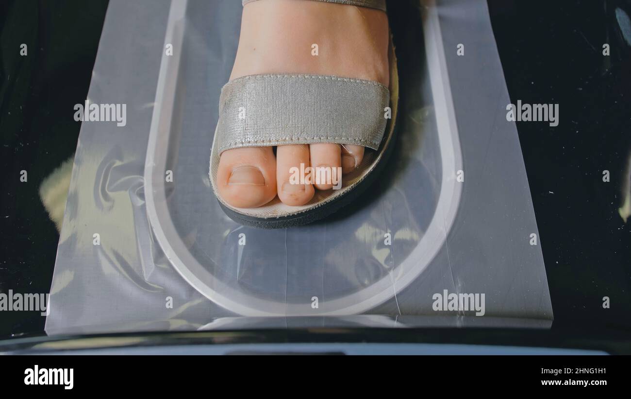 Automatic Thermal Shrinkable Shoe Cover Laminating Machine. Close up ...
