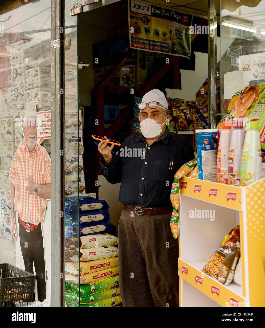 Bangkok, Thailand. 15th Feb, 2022. An Indian Sikh shop owner wearing a ...