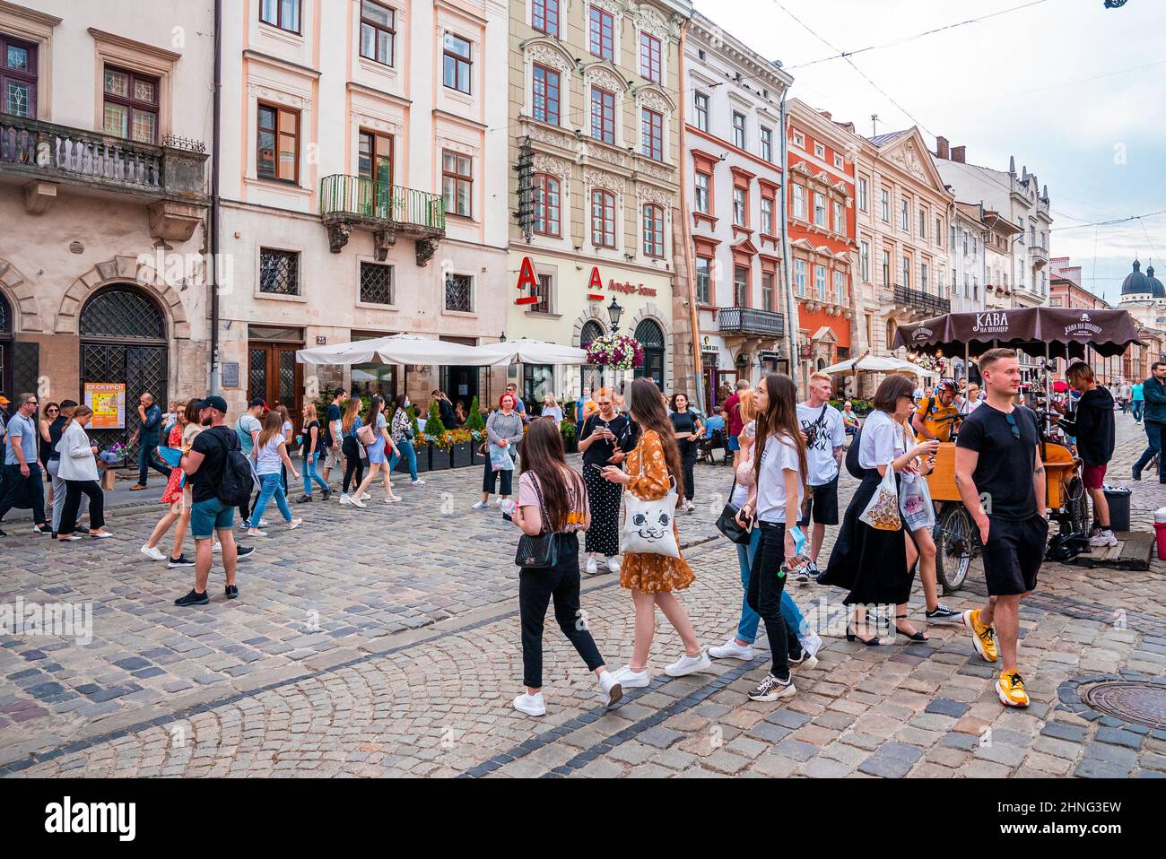 Crowd of people walking on streets with stalls at roadside Stock Photo ...