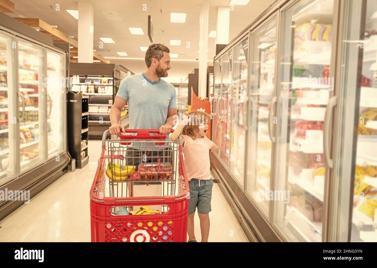 happy family day. father and son with shopping cart. customer consumer ...