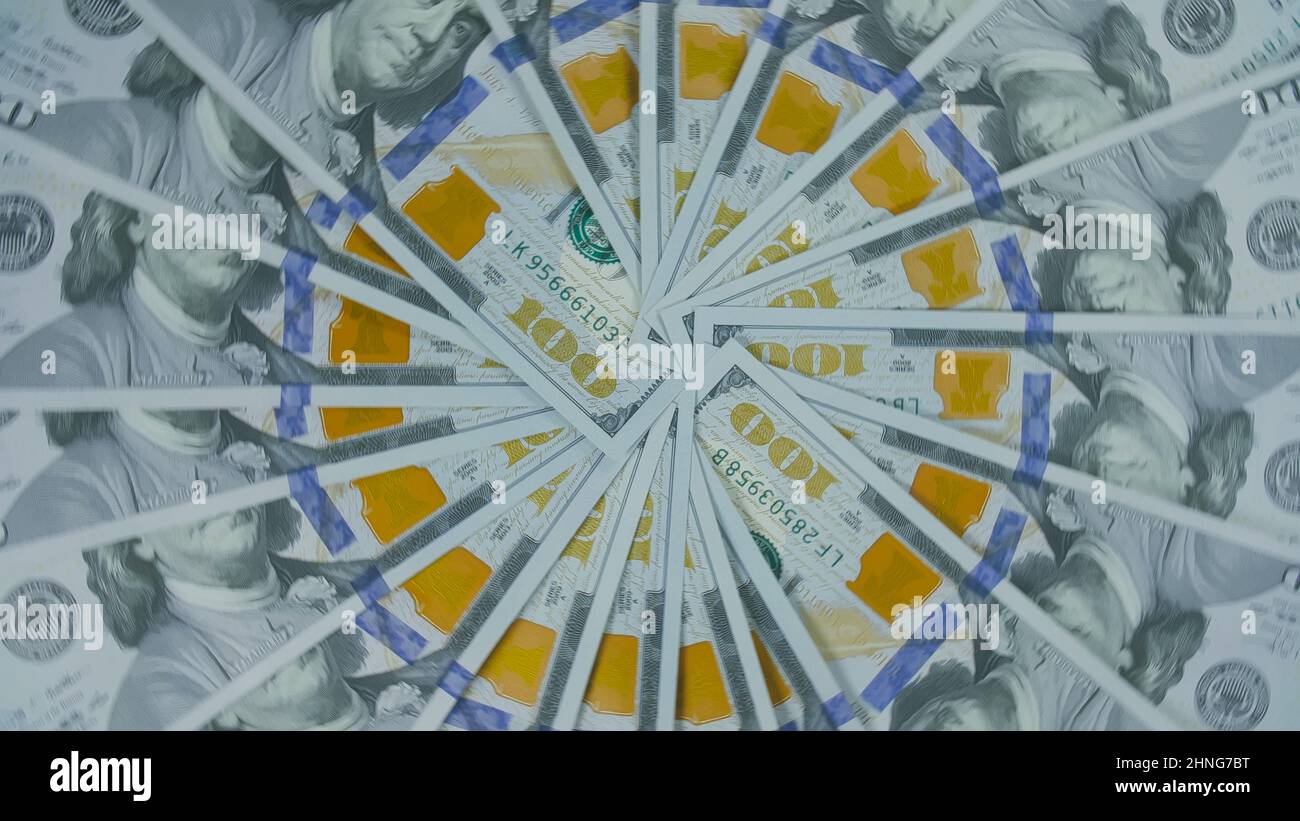 Many dollar are arranged around the edges of the image as a frame ...