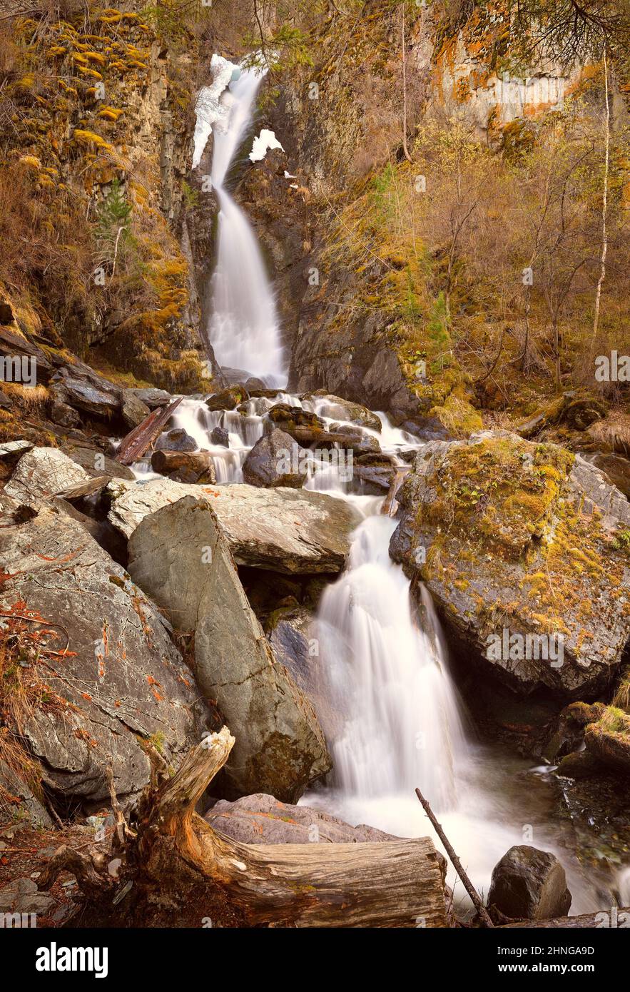 Chibitsky waterfall in the Altai Mountains. A spring stream of water ...
