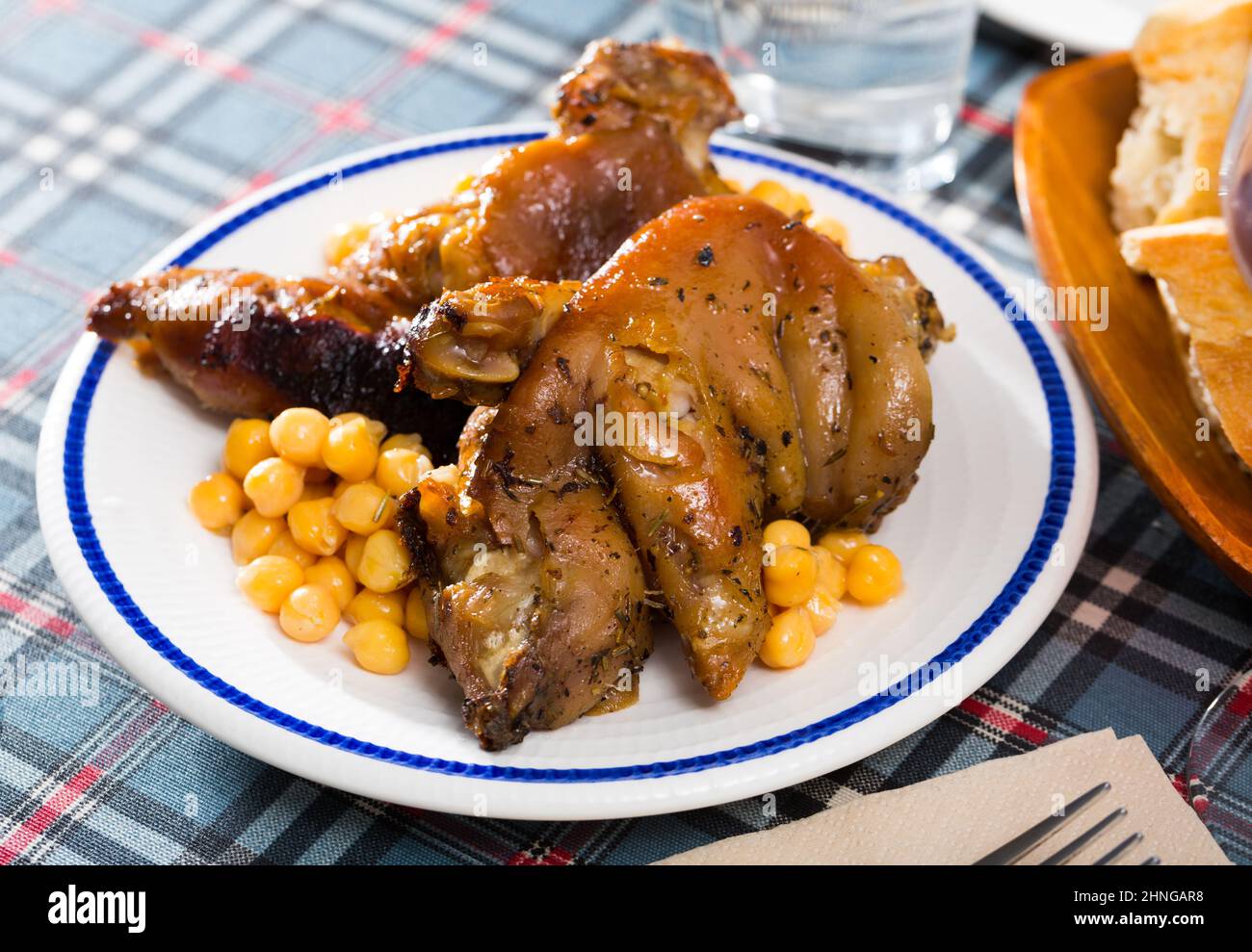 Roasted pettitoes with chickpeas Stock Photo - Alamy