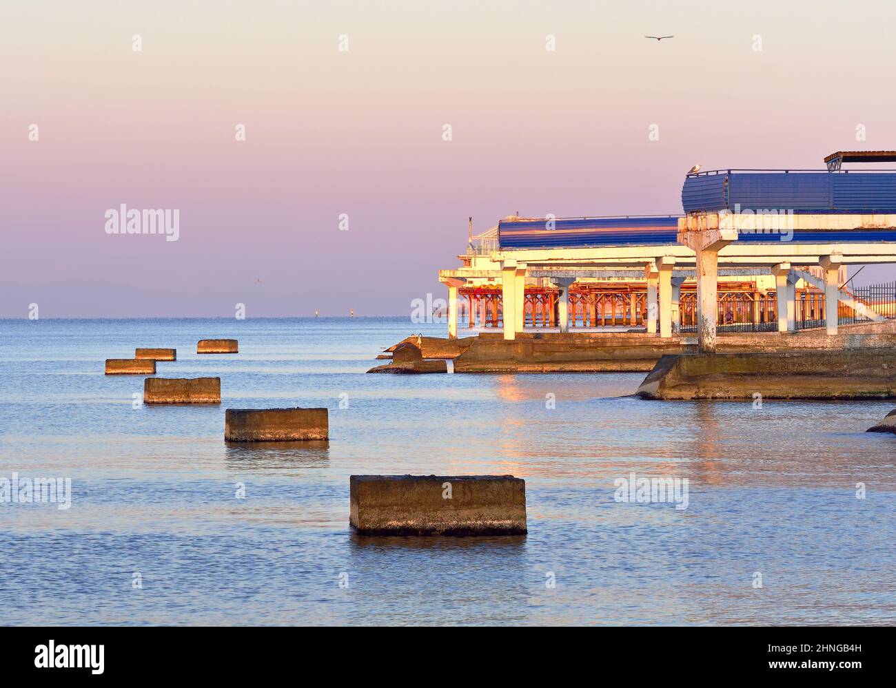 Sea barriers at dawn. Old coastal structures on the Black Sea beach in ...