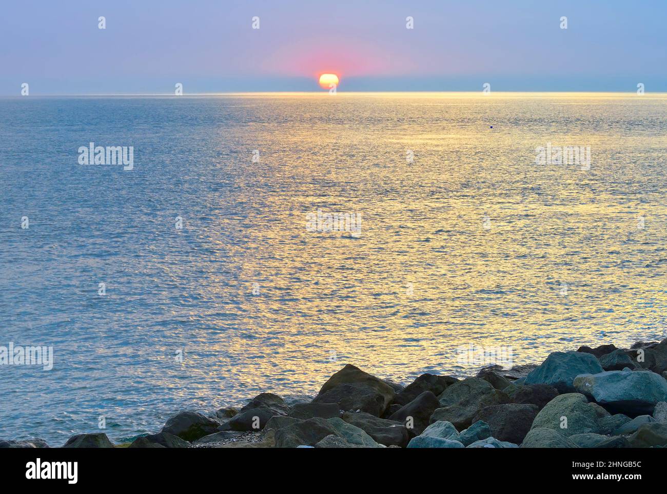 Sunset on the Black Sea. The golden surface of the water in the evening ...