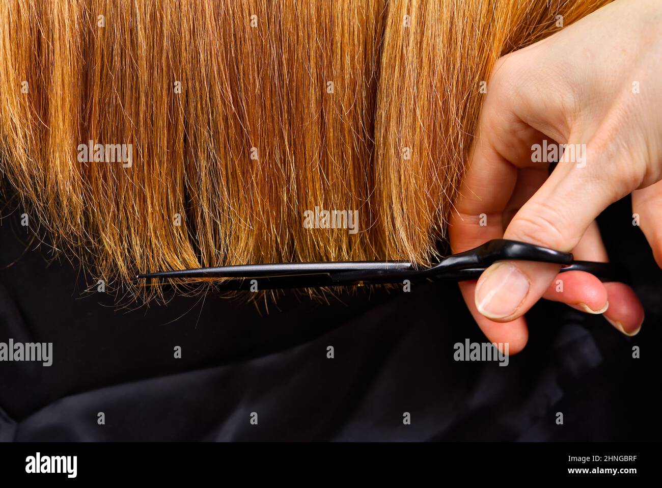 Woman hair care. Hairdresser making hairstyle to young girl in beauty ...