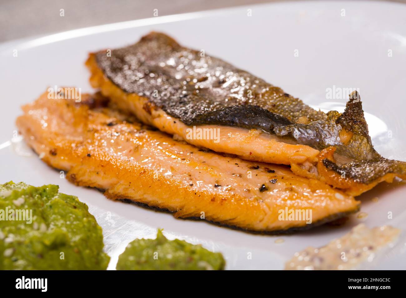 Grilled trout fillet with mashed broccoli Stock Photo - Alamy