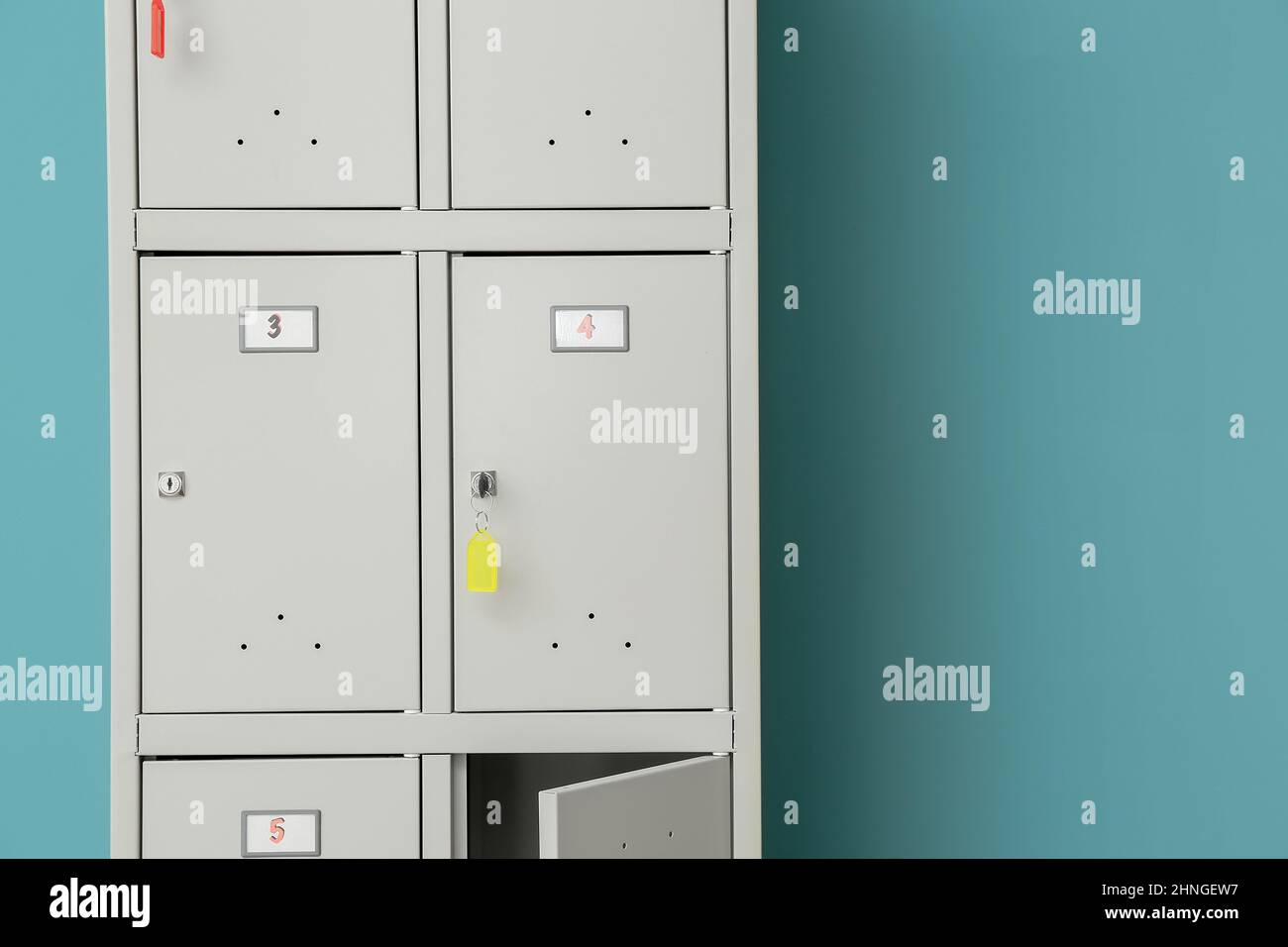 Modern locker on blue background Stock Photo - Alamy