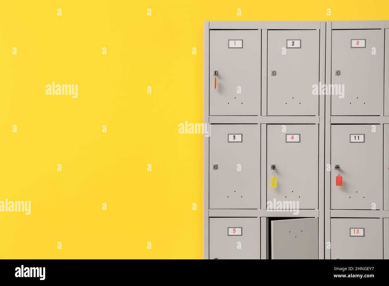 Modern locker near yellow wall Stock Photo - Alamy